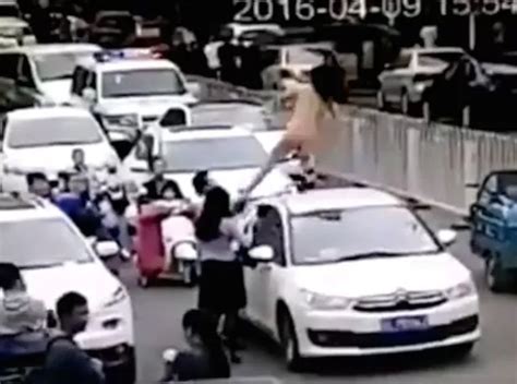 Naked Woman Dances On Top Of Car Causing Traffic Jam Before Driver