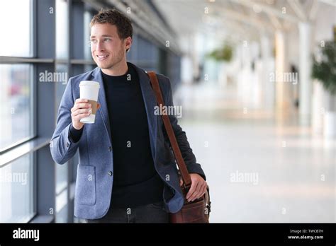 Businessman Drinking Coffee Walking In Airport Casual Urban