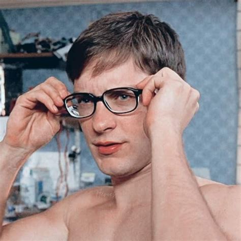A Shirtless Man With Glasses On His Face