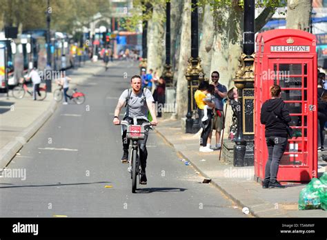 London England Uk Cyclists Riding On The Cycle Path Along The