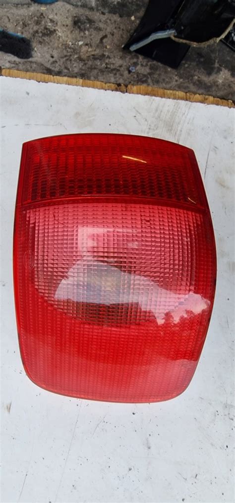 LAMPA TYŁ TYLNA LEWA W BŁOTNIKU AUDI 80 B4 SEDAN 13148829031