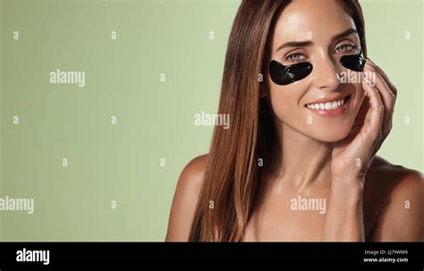 Confident Adult Woman Applying Anti Aging Eye Patch On Her Face Beautiful Female Woman Applying