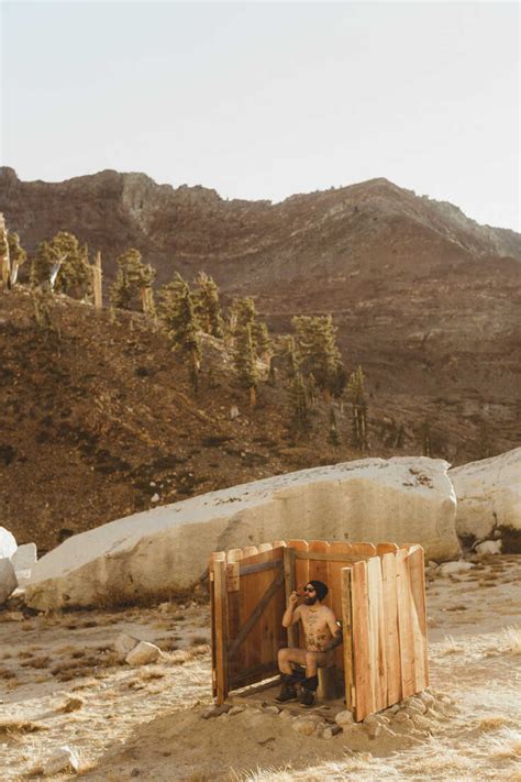 Naked Male Hiker Sitting On Outdoor Toilet Smoking A Pipe Mineral King
