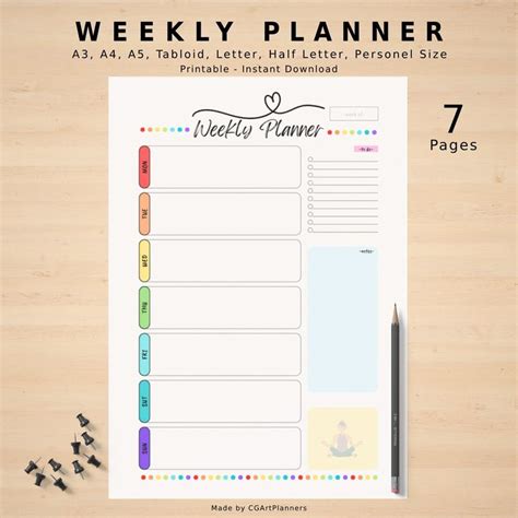The Weekly Planner Is On Top Of A Wooden Table Next To Pencils And Markers