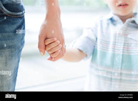 Mother Holding Son Hand Hi Res Stock Photography And Images Alamy