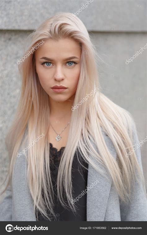 Stunning Blue Eyed Blond Woman Portrait Stock Photo By Vladeephoto