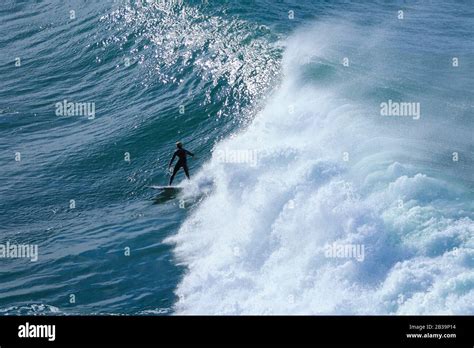 Surfer On Blue Ocean Wave Stock Photo Alamy