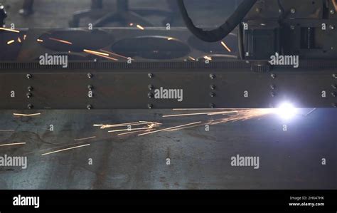 Cutting Of Metal Sparks Fly From Laser Cut Sheet Metal At Workshop