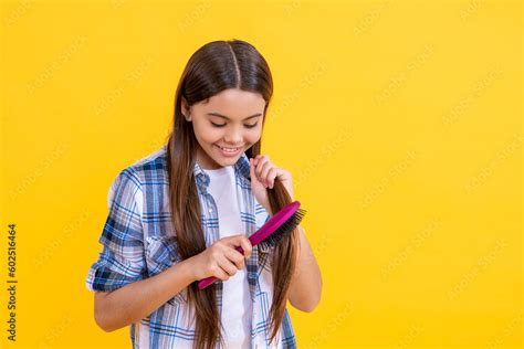 Teen Girl Using A Hairbrush To Style Her Hair Copy Space Teen Girl Holding Hairbrush While