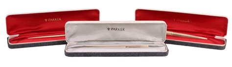 A Cased Parker Gilt Writing Set Comprising A 65 Fountain Pen A