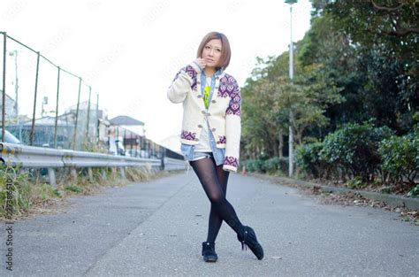 Japanese Girl Poses On The Street In Enoshima Japan Enoshima Is An