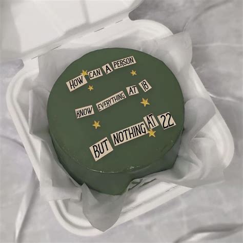 There Is A Green Cake With Writing On It
