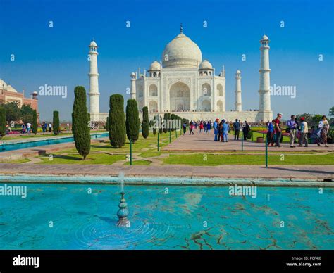 Tourists Visiting The Taj Mahal The Ivory White Marble Mausoleum In