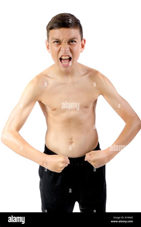 Shirtless Teenage Boy Flexing His Muscles Isolated On White Background