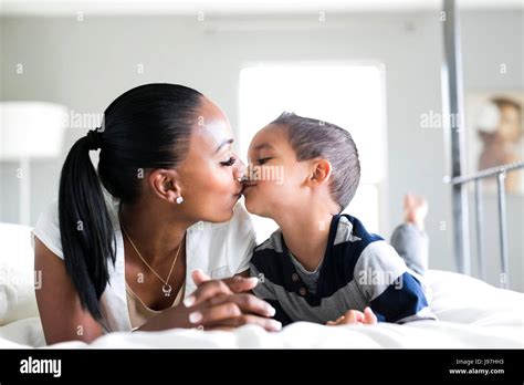 Mother Kissing Son 2 3 Stock Photo Alamy