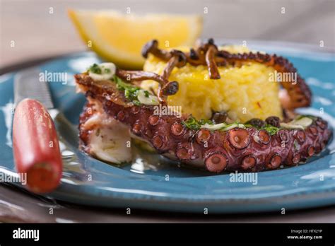 Grilled Seafood Octopus On Saffron Risotto With Brown Shimeji Mushrooms