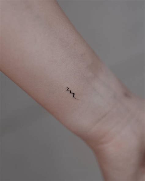 Minimalistic Tattoo Located On The Wrist
