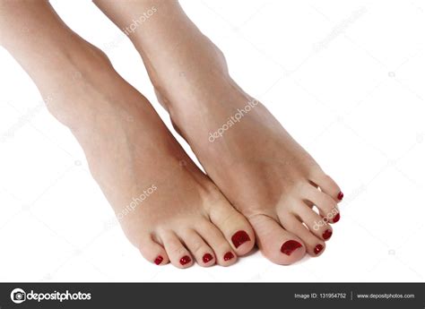 Closeup Photo Of Beautiful Female Feet With Red Pedicure Clean Soft Skin Healthy Nails With
