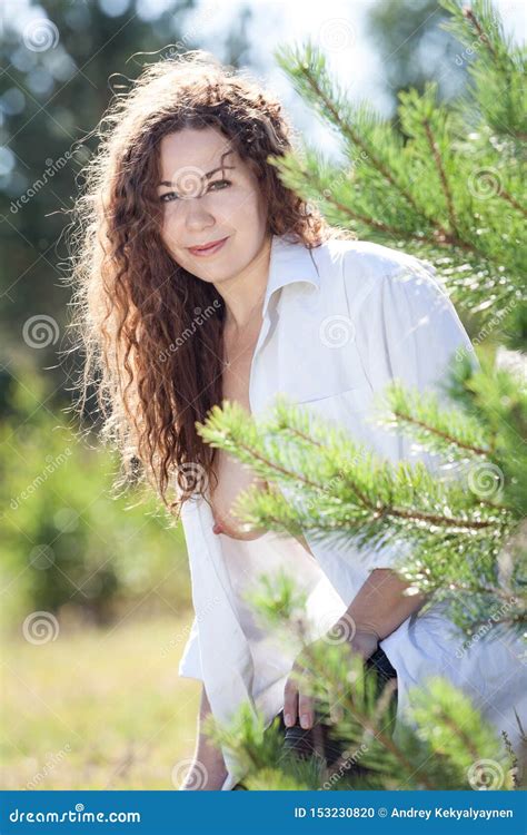 Portrat Of Pretty Woman With Curly Disheveled Hair And Naked Breast