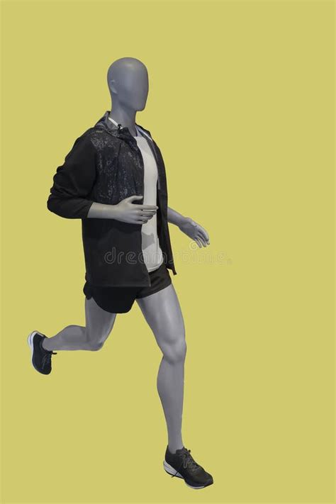Running Male Athlete With Muscular Naked Torso Wearing Shorts On Blue