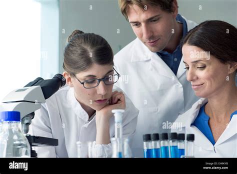 Scientists Conducting Experiment In Laboratory Stock Photo Alamy