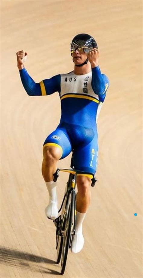 A Man Riding A Bike On Top Of A Track