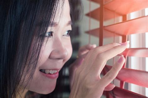 Premium Photo Asian Woman Hands Apart On The Window Blinds
