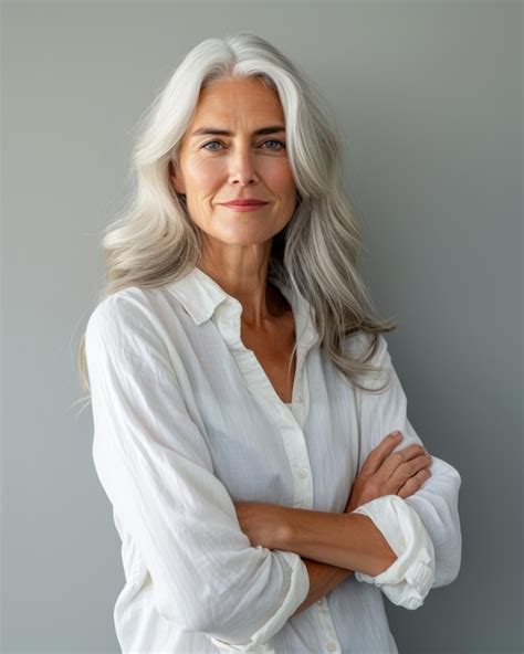Premium Photo An Older Woman With White Hair Standing With Her Arms