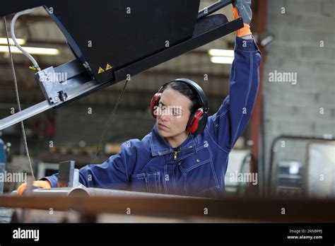 Women Press Cuts Using Different Machines Stock Photo Alamy