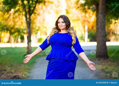 Happy Plus Size Model In Blue Dress Outdoors Fat Woman In Autumn Park