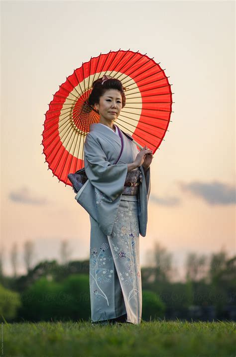 Japanese Woman Wearing Kimono And Holding Traditional Umbrella Del