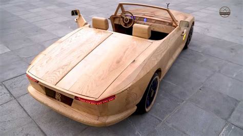 A Scaled Down Rolls Royce Boat Tail Replica Out Of Wood Tree Frog