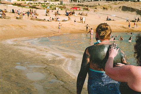 Friends Helping Each Other To Apply Dead Sea Mud By Stocksy