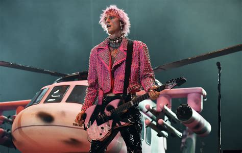 Machine Gun Kelly Zip Lines Across Stadium Smashes Glass On His Own