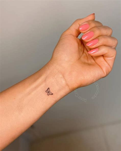 Fine Line Minimalistic Butterfly Tattooed On The Wrist