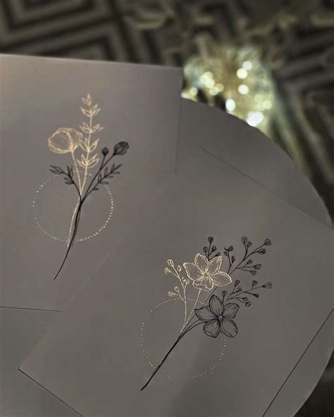 Four Cards With Flowers On Them Sitting On A Table
