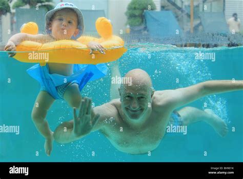 Father Son Swimming Underwater In Hi Res Stock Photography And Images