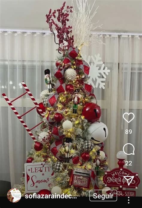 A Christmas Tree Decorated With Red And White Ornaments