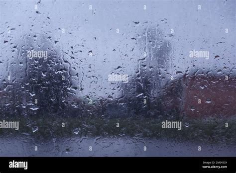Rain Droplets On Window With Out Of Focus Background Stock Photo Alamy