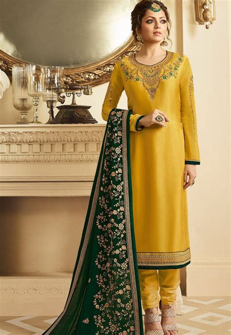 Drashti Dhami Yellow Satin Georgette Embroidered Churidar Suit