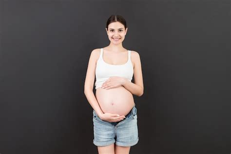 Premium Photo Naked Pregnant Woman S Belly Wearing Opened Jeans At