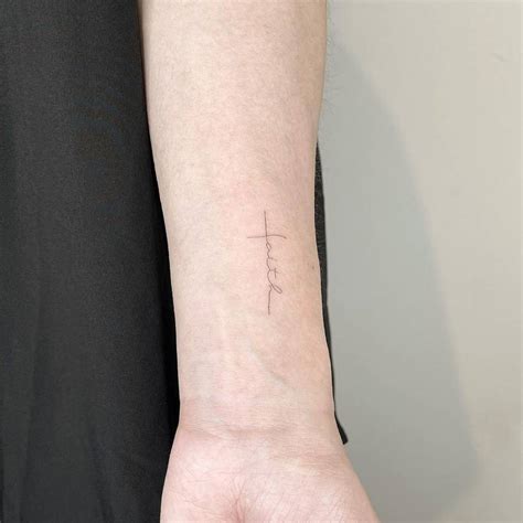 Faith Cross Lettering Tattoo On The Wrist