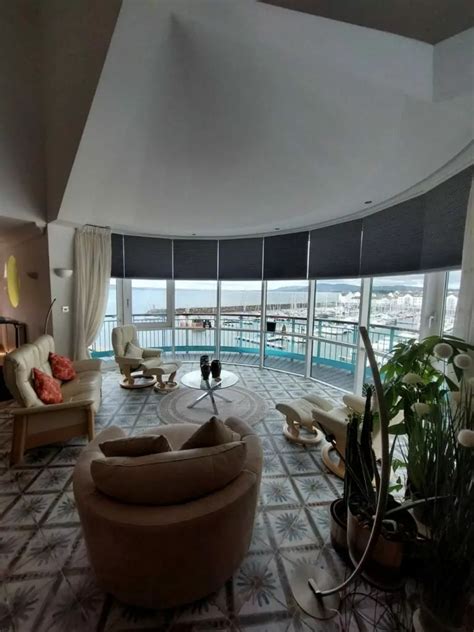 Curved Bay Window Blinds Framing A Stunning View