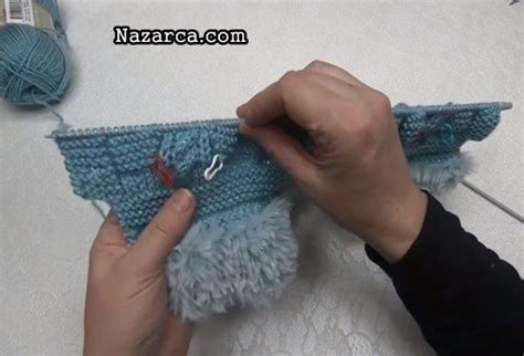 Someone Is Knitting Something With Yarn On The Table