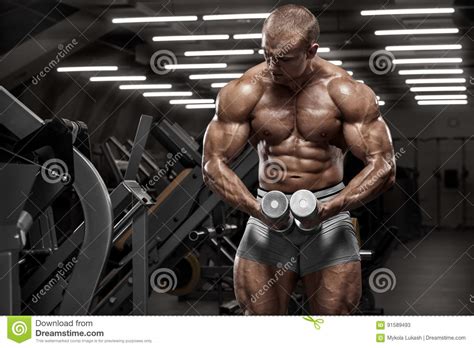 Muscular Man Working Out In Gym Doing Exercises Strong Male Naked