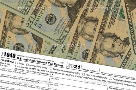 U S Individual Income Tax Return Form 1040 And Hundred Dollar Bills