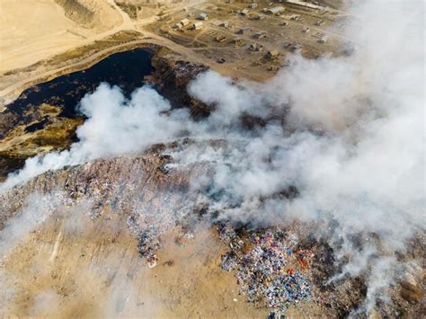 Premium Photo Aerial View Of Landfill With Burning Trash Piles