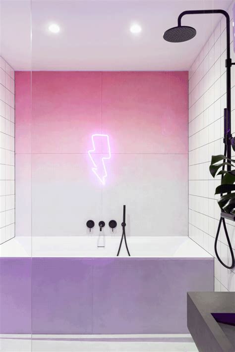A Bathroom With Pink And Purple Walls White Tile Flooring And A Bathtub