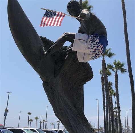 Naked Surfer Statue In Huntington Beach Ca Photos