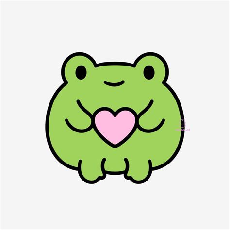 A Green Frog With A Pink Heart In Its Mouth